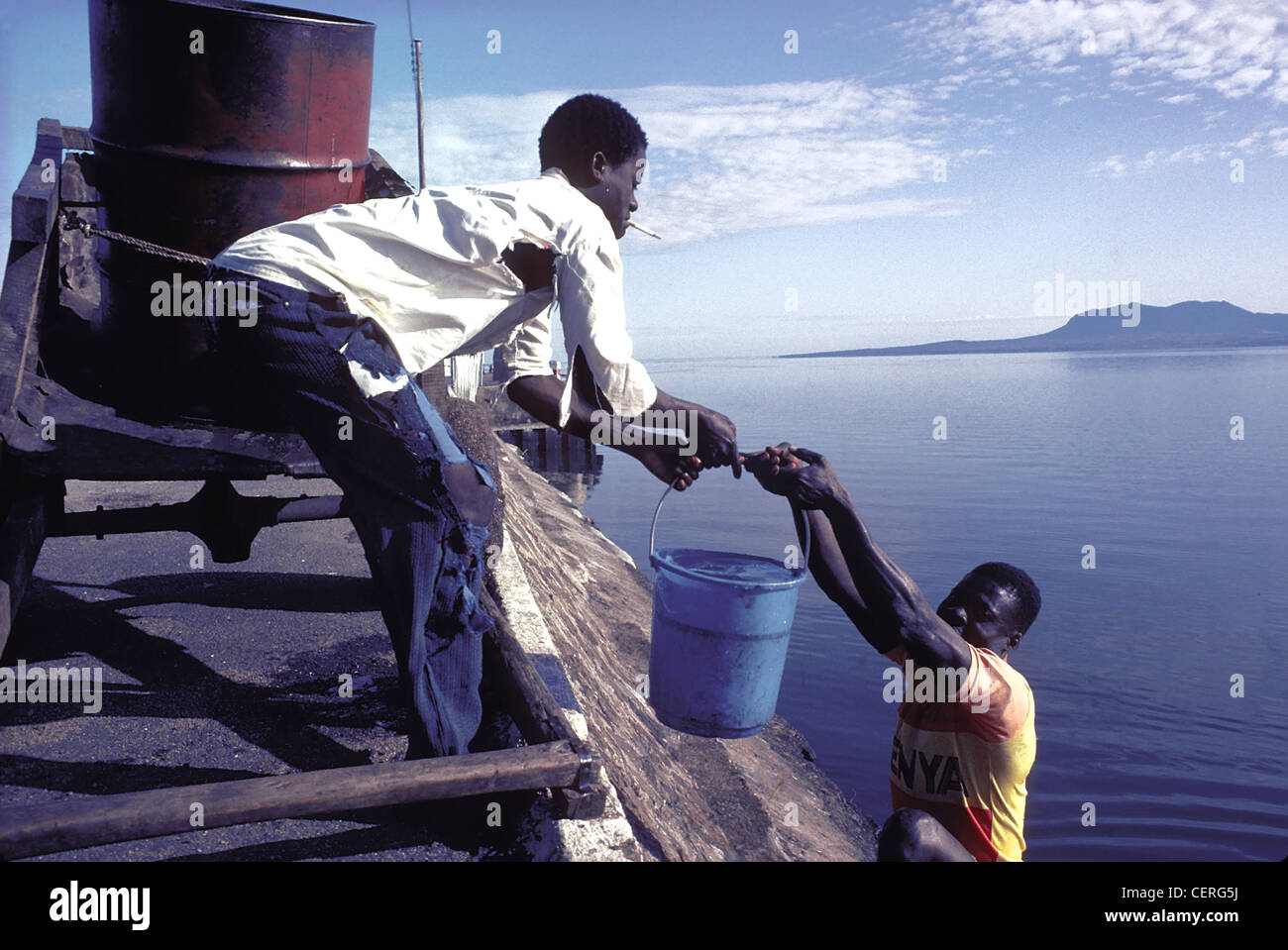 Collecting water from Lake Victoria Stock Photo - Alamy