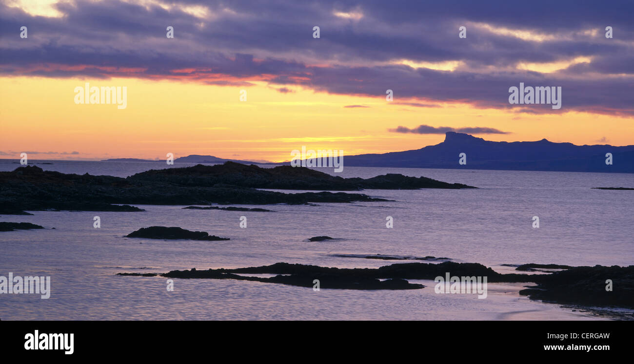 A sunset over the islands of Rhum and Eigg Stock Photo - Alamy