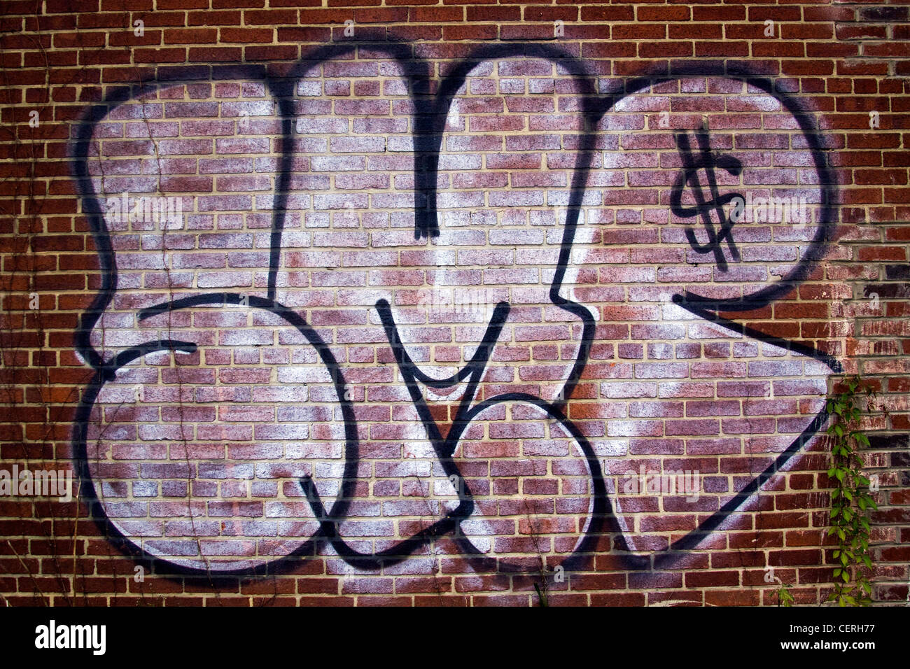 Graffiti art on a brick wall of a row-house near an alley at “The Yards ...