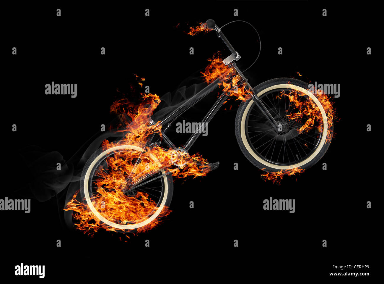 Bike in fire on black background Stock Photo - Alamy