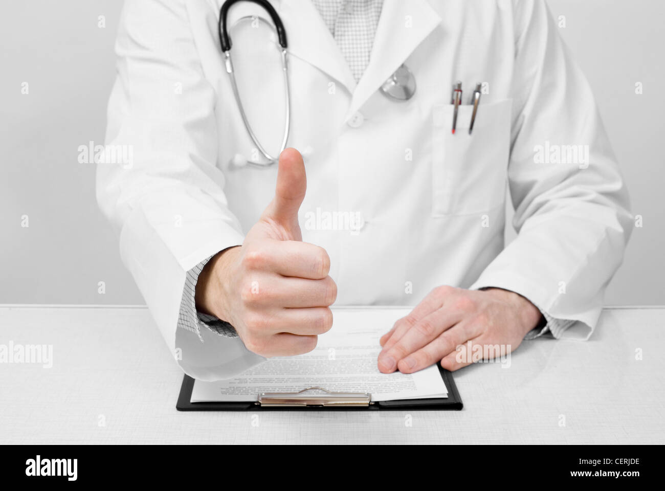 Young doctor showing ok sign with thumg up saying "very good Stock ...