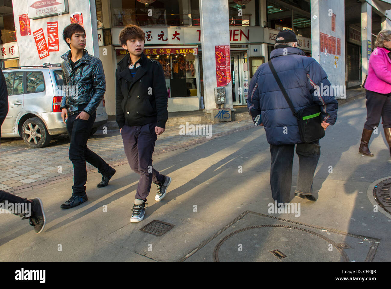 Paris, France, Chinese Teenagers Migrants Walking on Street in ...