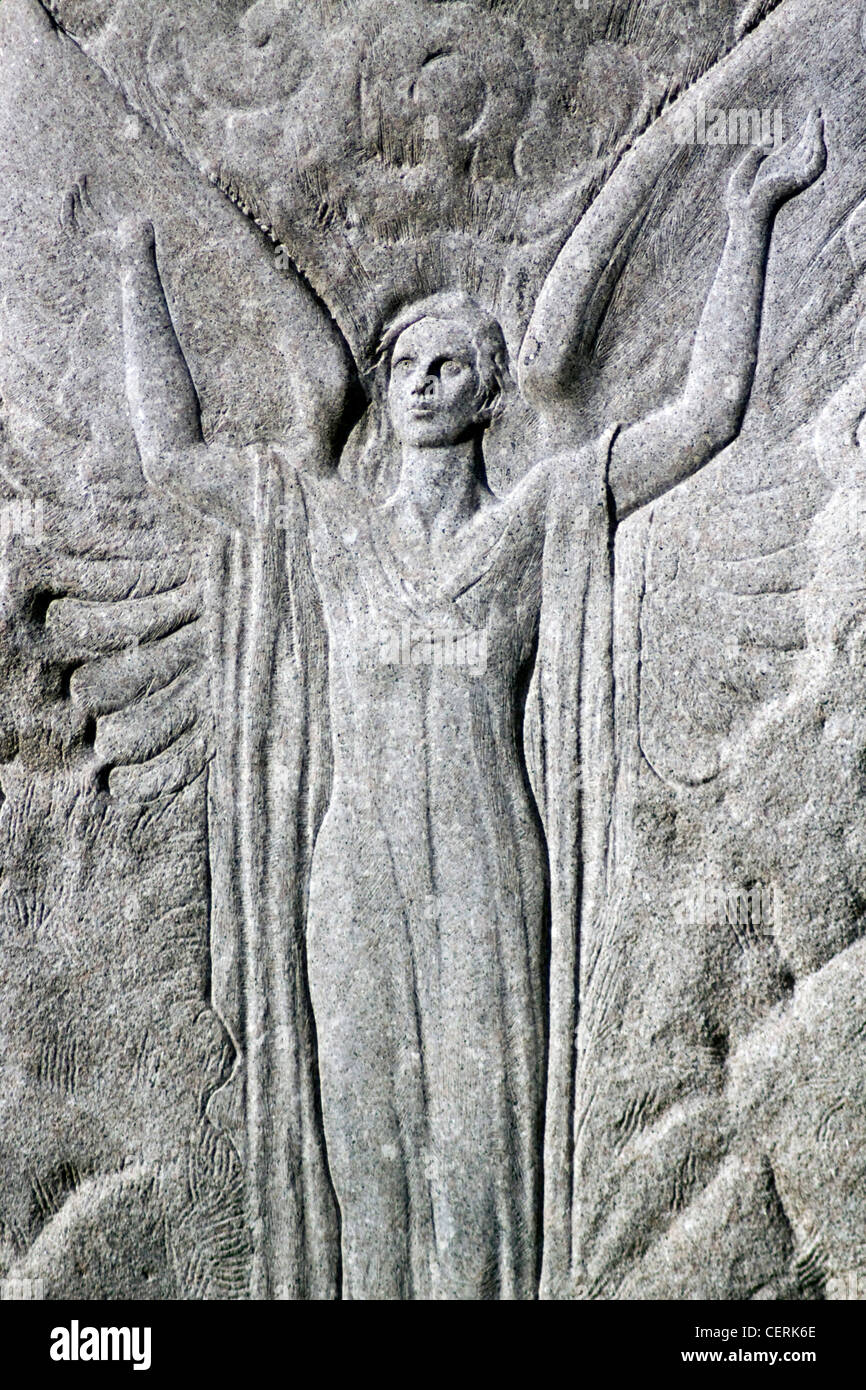 An angle bas relief on a granite headstone at Oak Hill Cemetery located ...