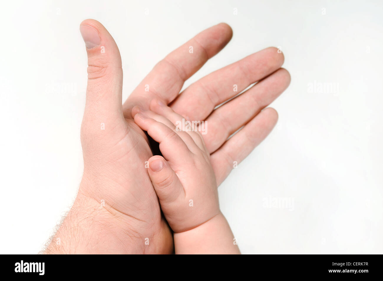 Men's and children's hand isolated on white background Stock Photo - Alamy