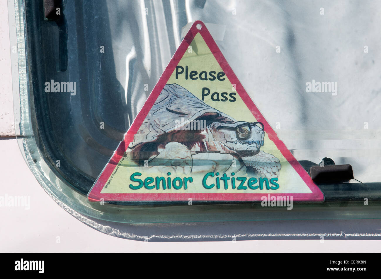 Please pass senior citizens sign on an old caravan Stock Photo - Alamy