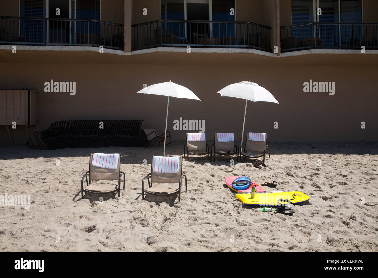 Beach set up with chair and umbrellas Stock Photo - Alamy
