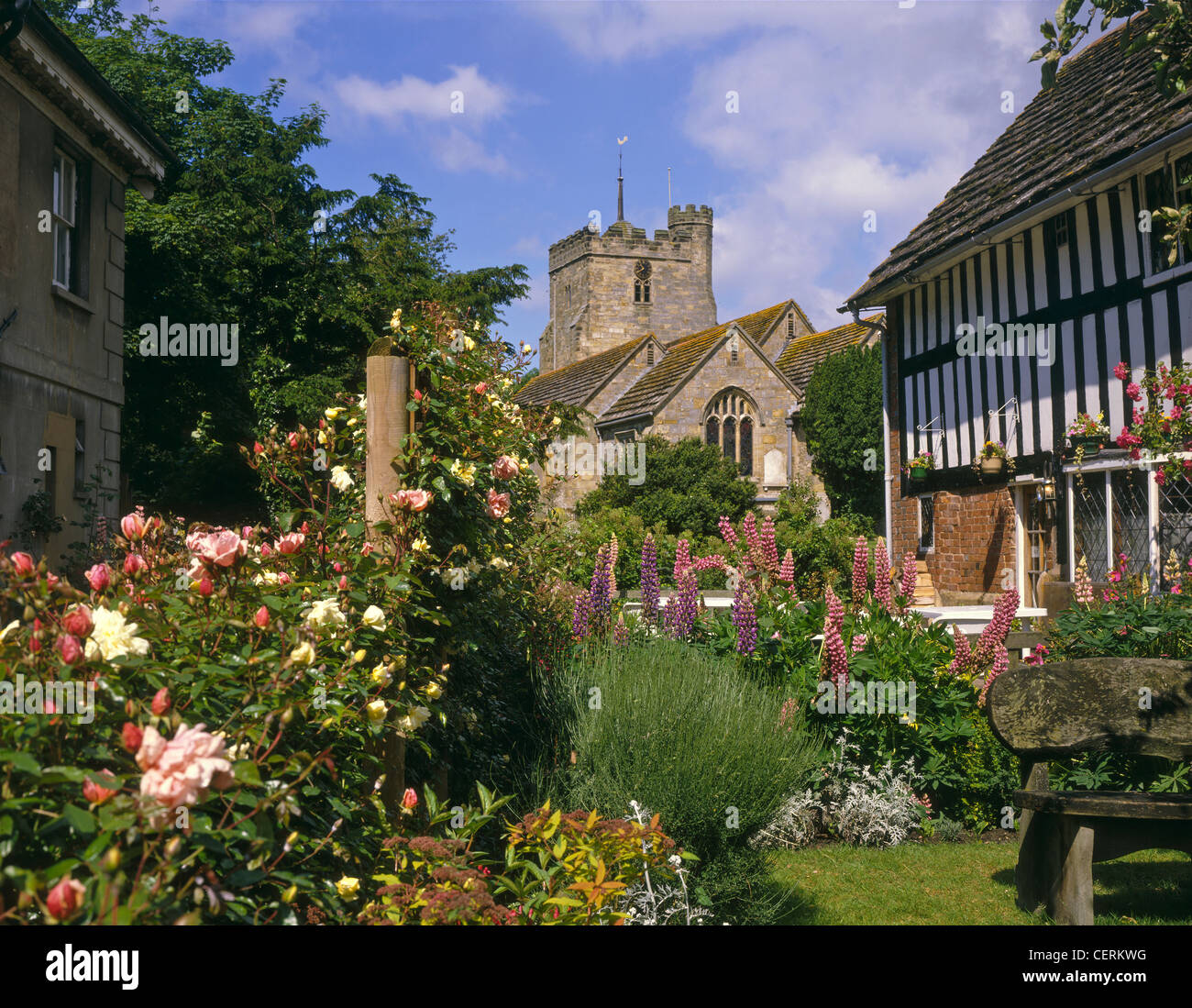 Cottages and flowers in bloom by the church in Cowfold Stock Photo - Alamy