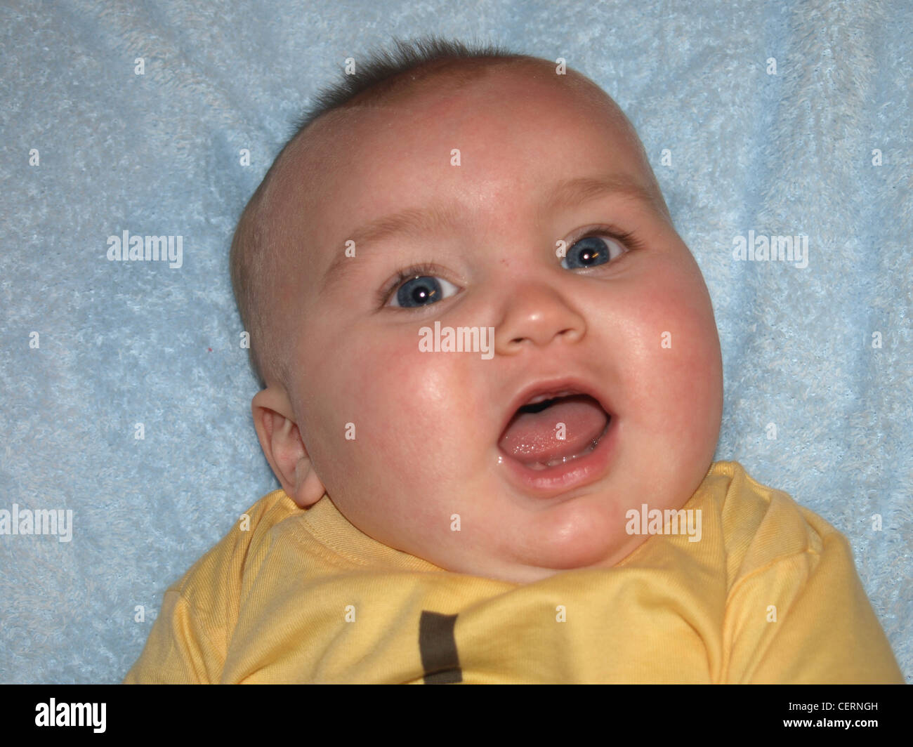 Male baby with mouth open Stock Photo - Alamy