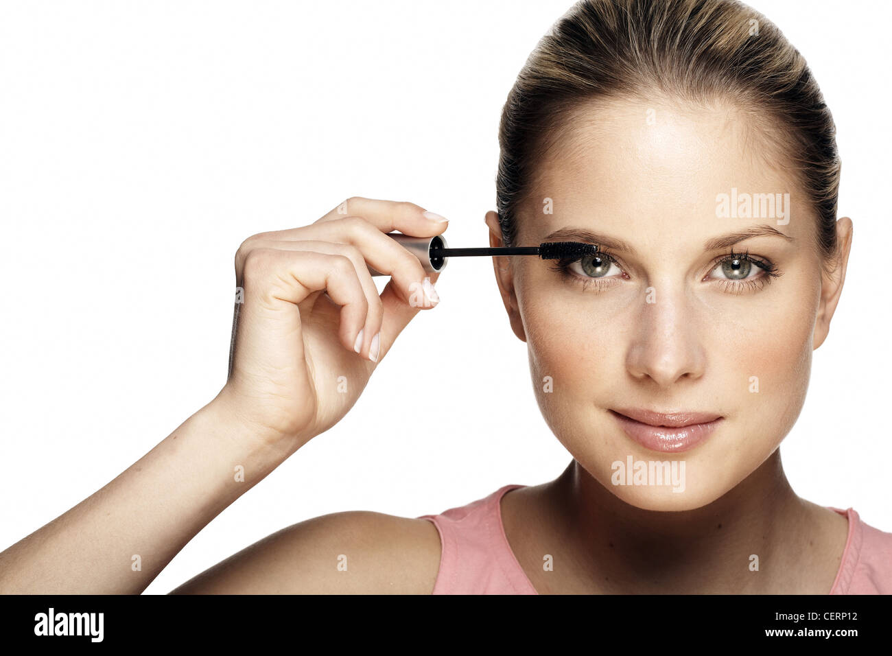 Female applying mascara Stock Photo - Alamy