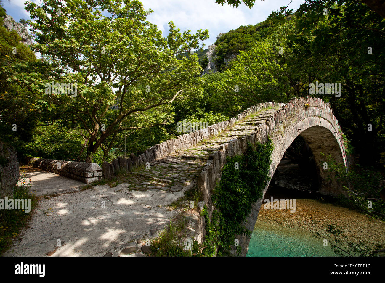 old Greek traditional arch style stone bridge at a nature protected ...