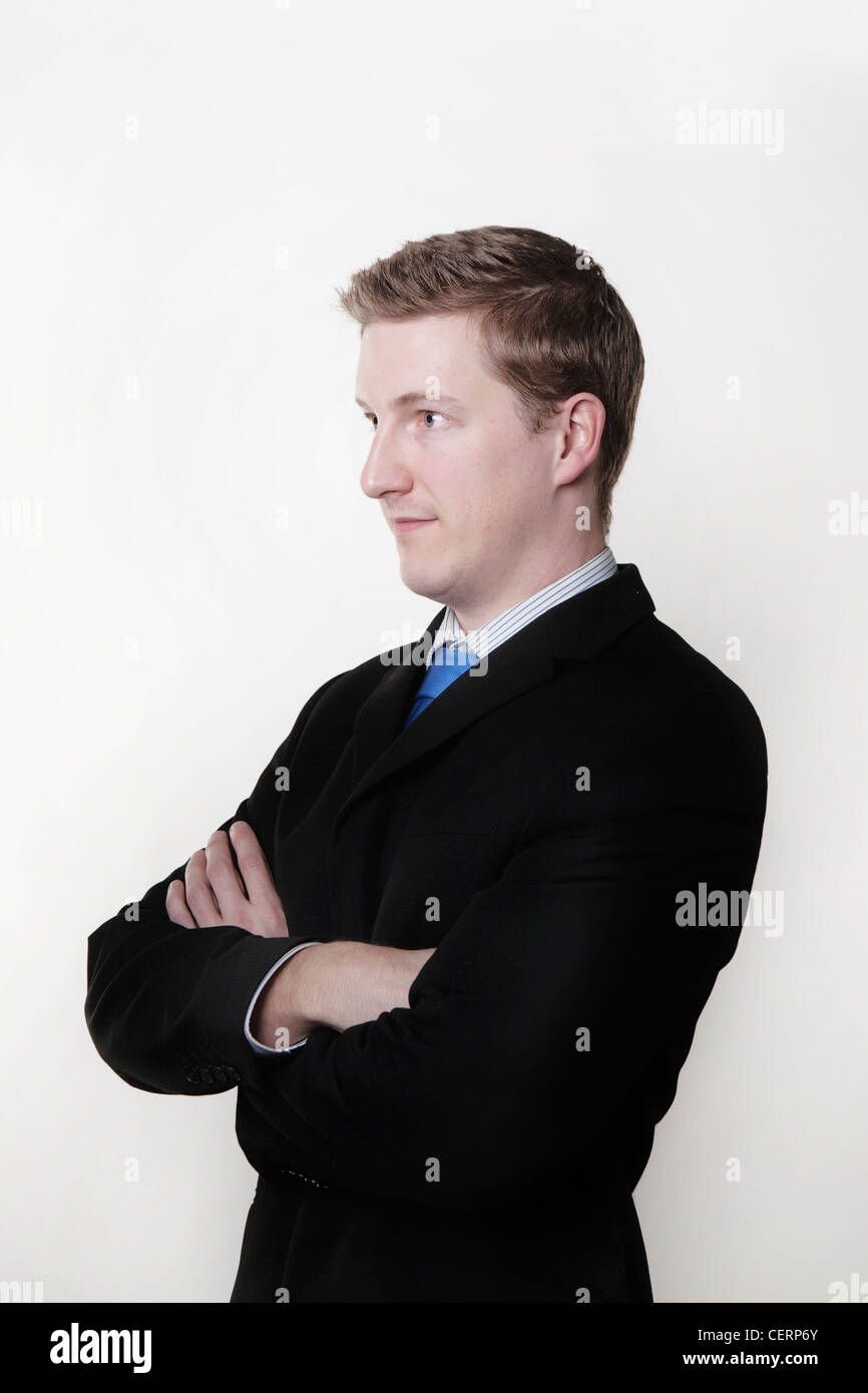 business man standing looking around Stock Photo - Alamy