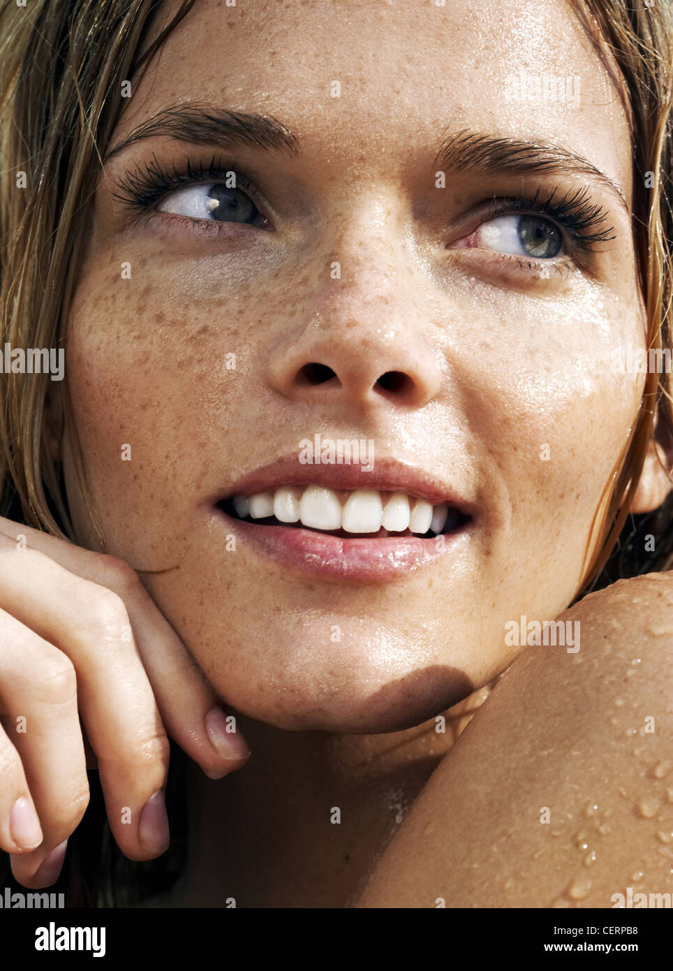 Female, blonde hair, freckles, clear lipgloss, white teeth, wet skin ...