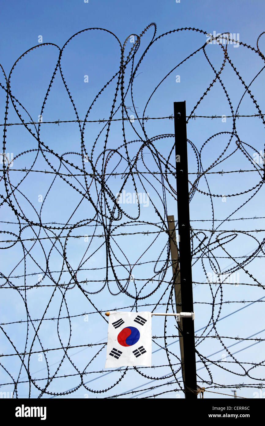 Barbed wire fence and South Korean flag at the DMZ, De-militarised Zone ...