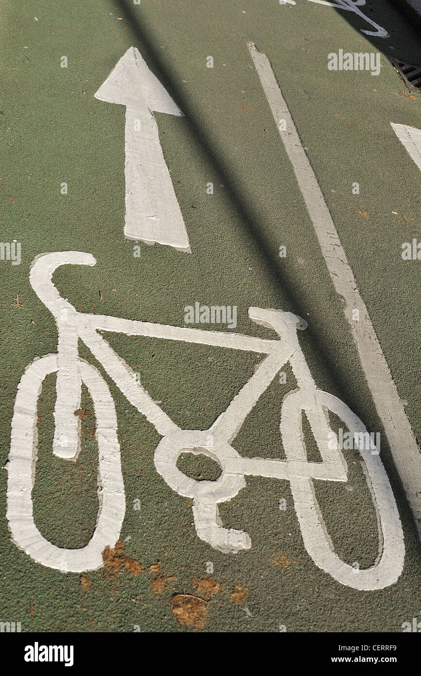 A white cycle graphic painted on a road indicating a cycle lane Stock ...
