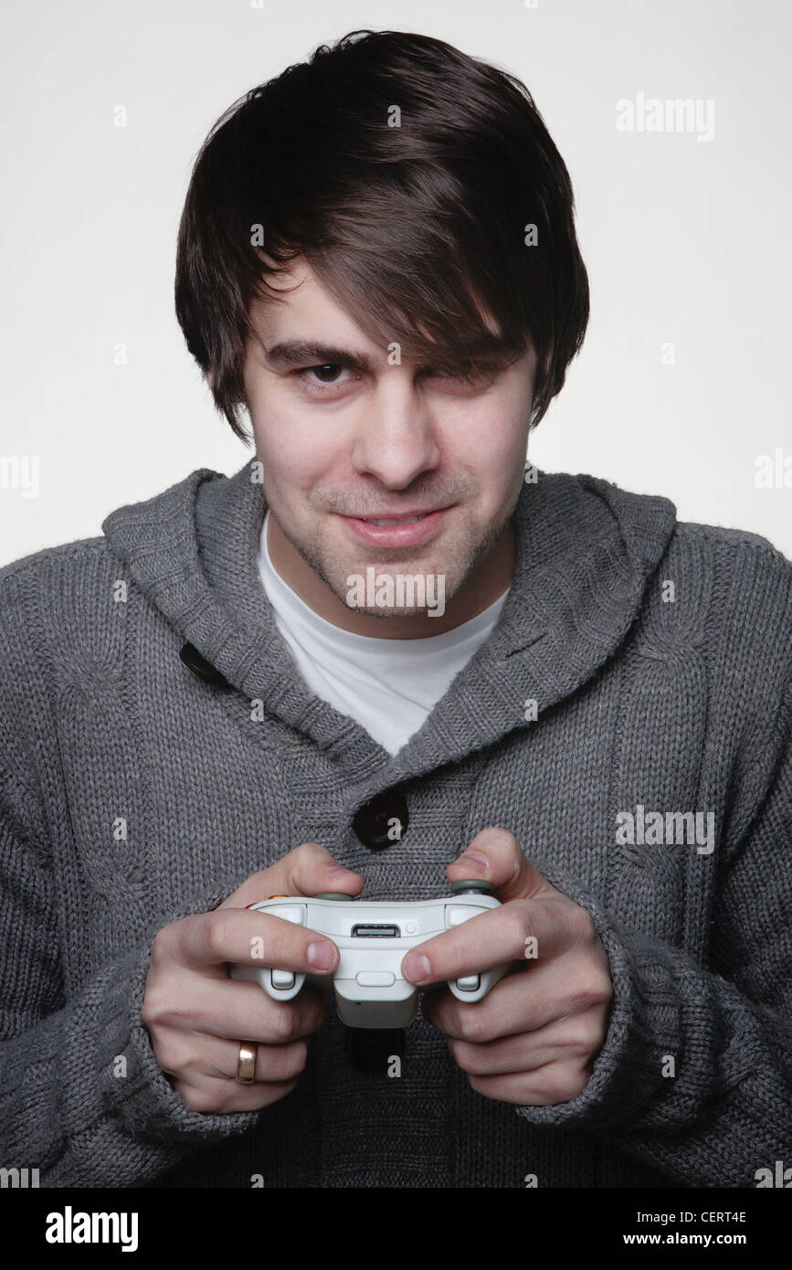 young guy playing a video game Stock Photo - Alamy