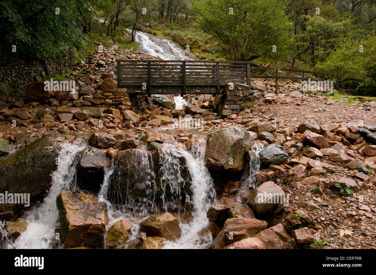 Waterfall and bridge at the edge of Buttermere in the Lake District UK ...