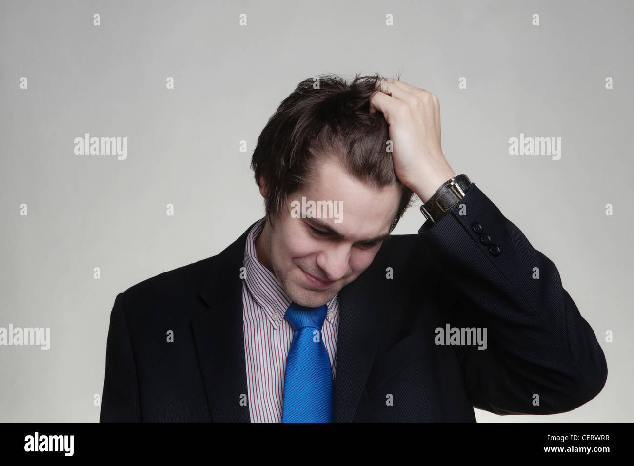 busniessman scratching his head Stock Photo - Alamy