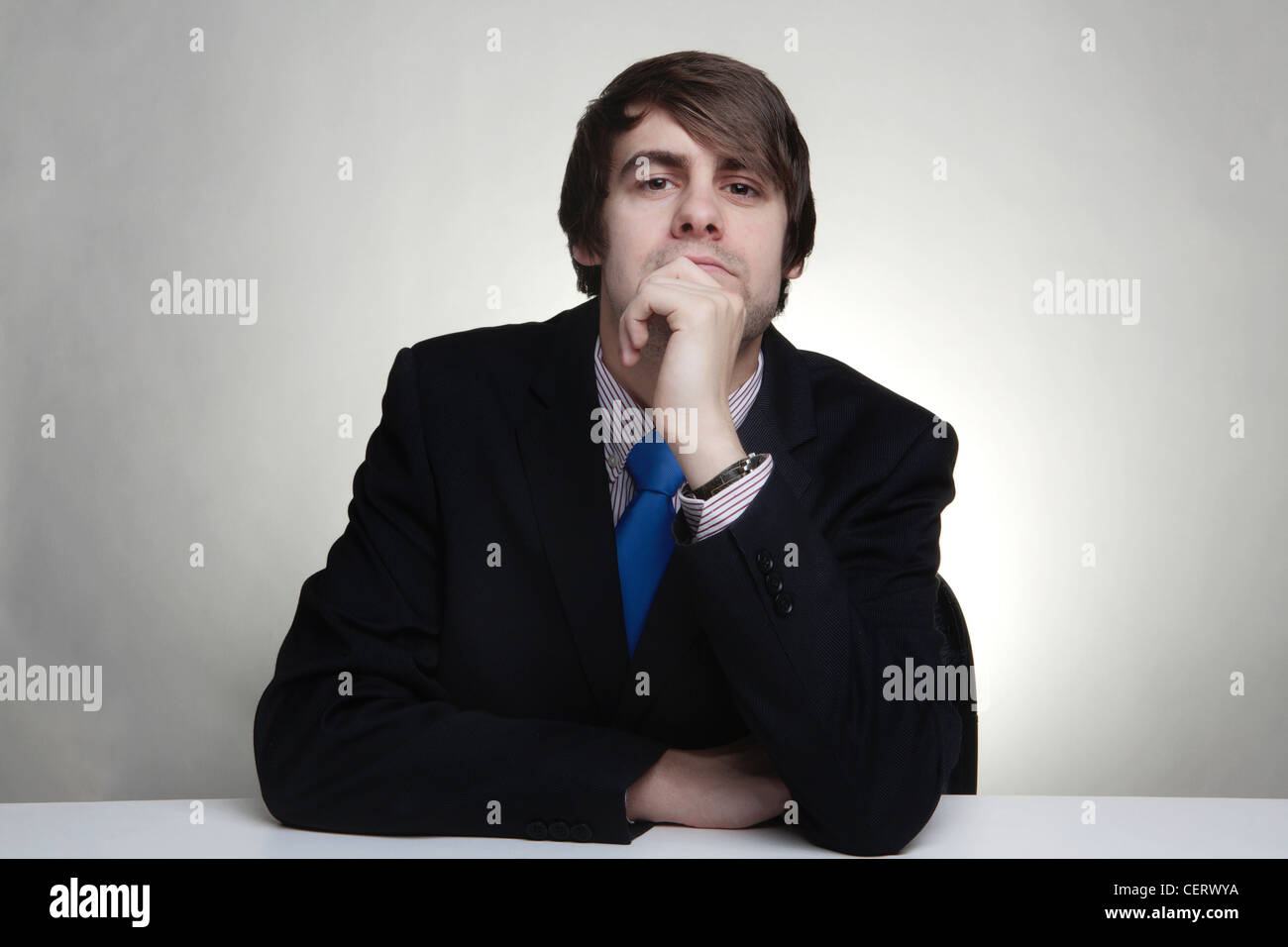 business man thinking looks deep in thought Stock Photo - Alamy