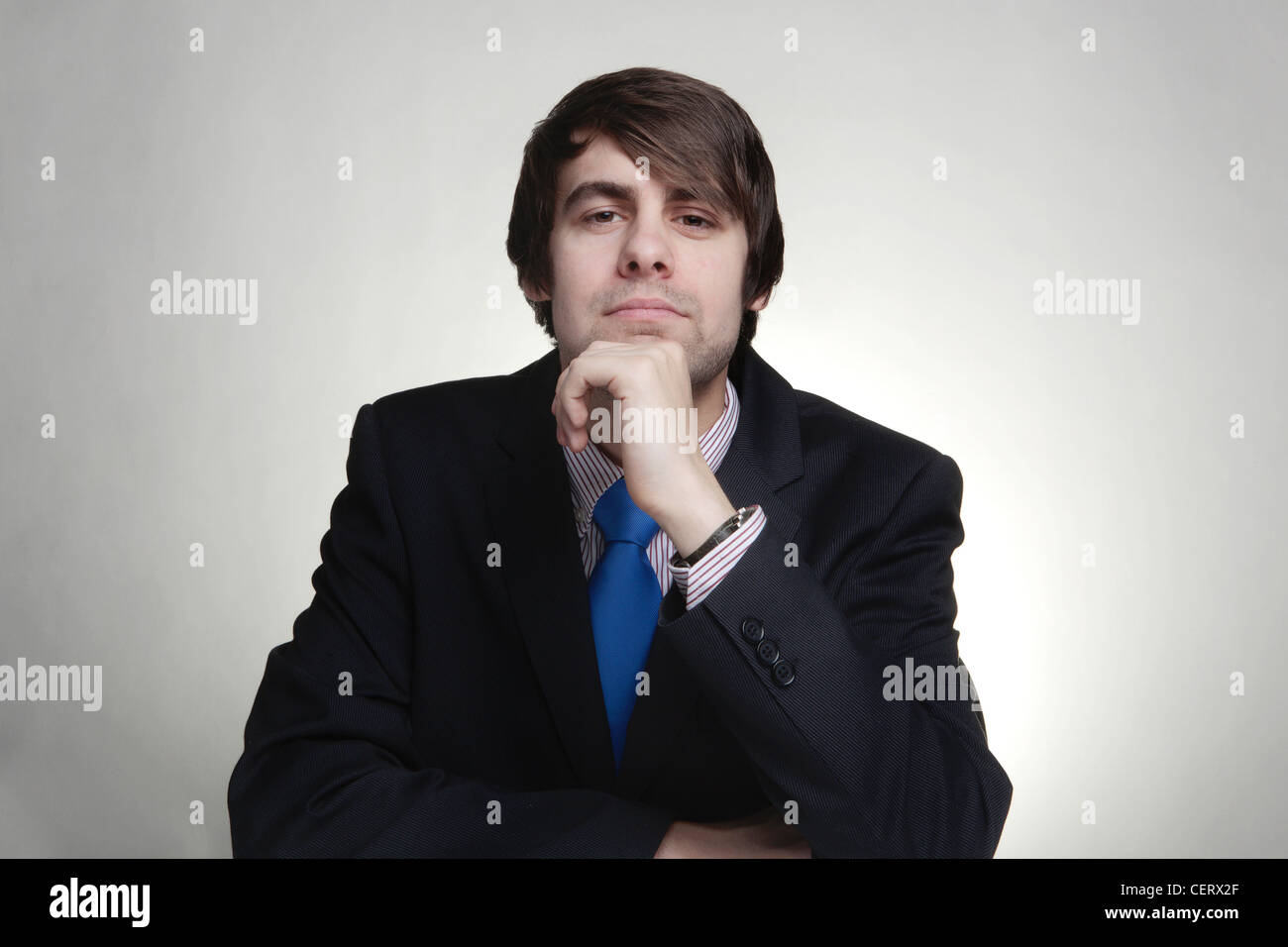 business man thinking looks deep in thought Stock Photo - Alamy