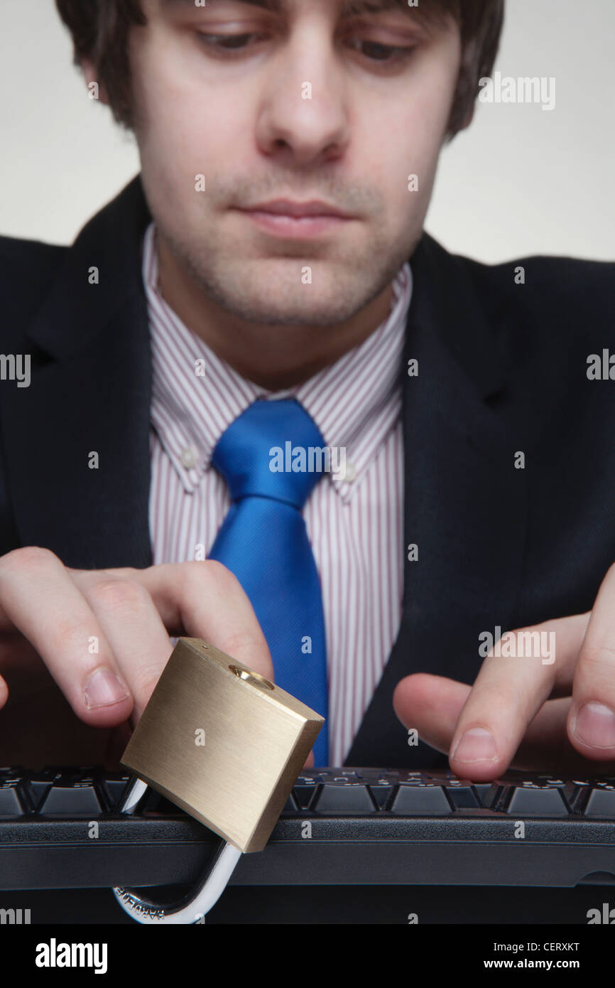 businessman with a padlock on his keyboard Stock Photo - Alamy