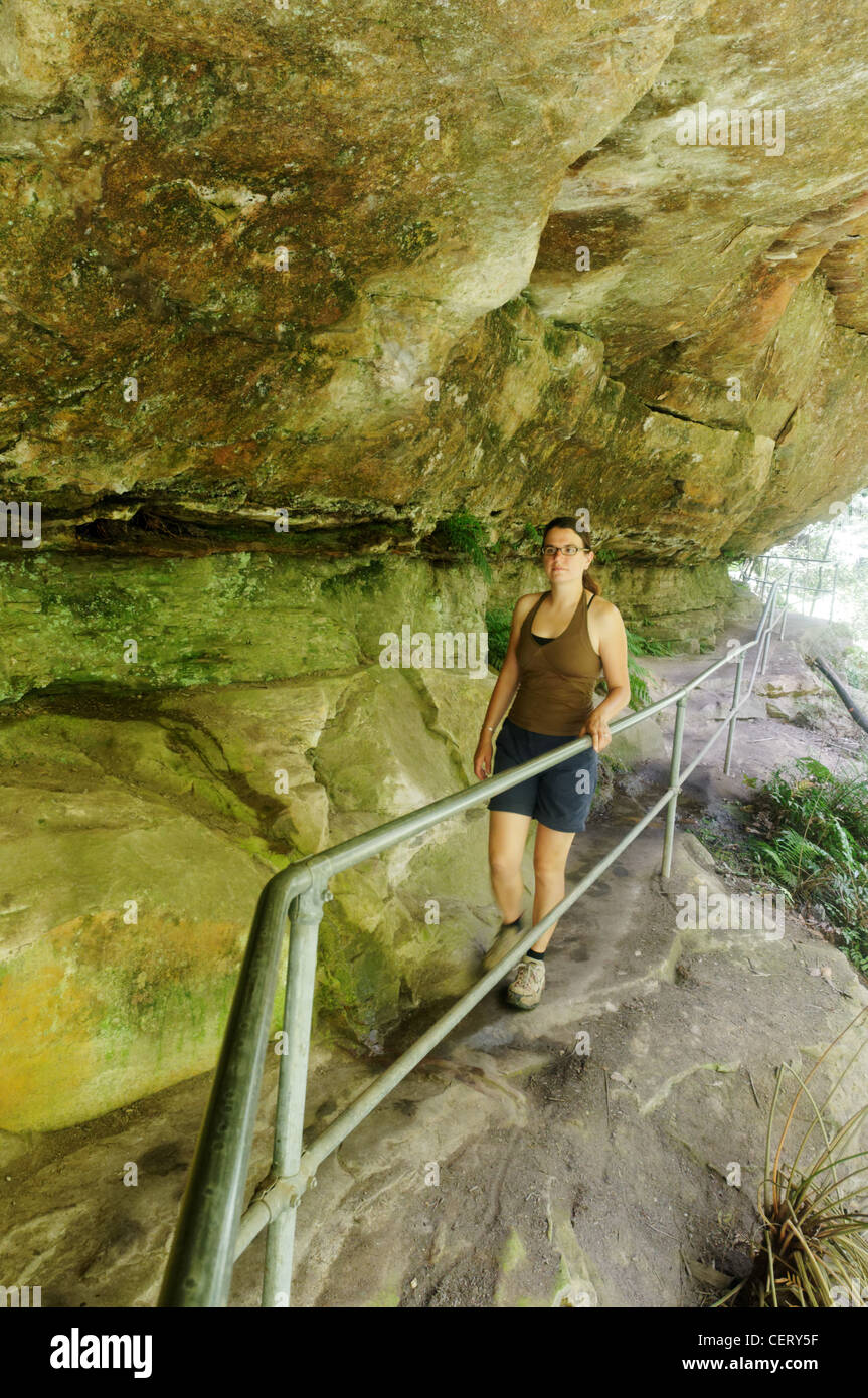 A young woman on a narrow footpath in the Blue Mountains, Australia ...