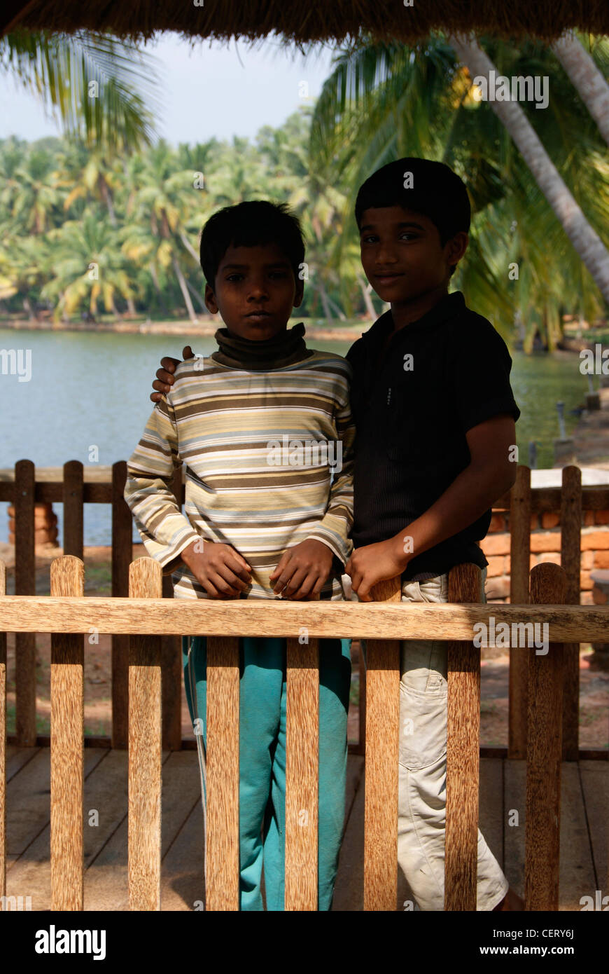 Native Indian Village boys in half shades of Tourist resort hut ...