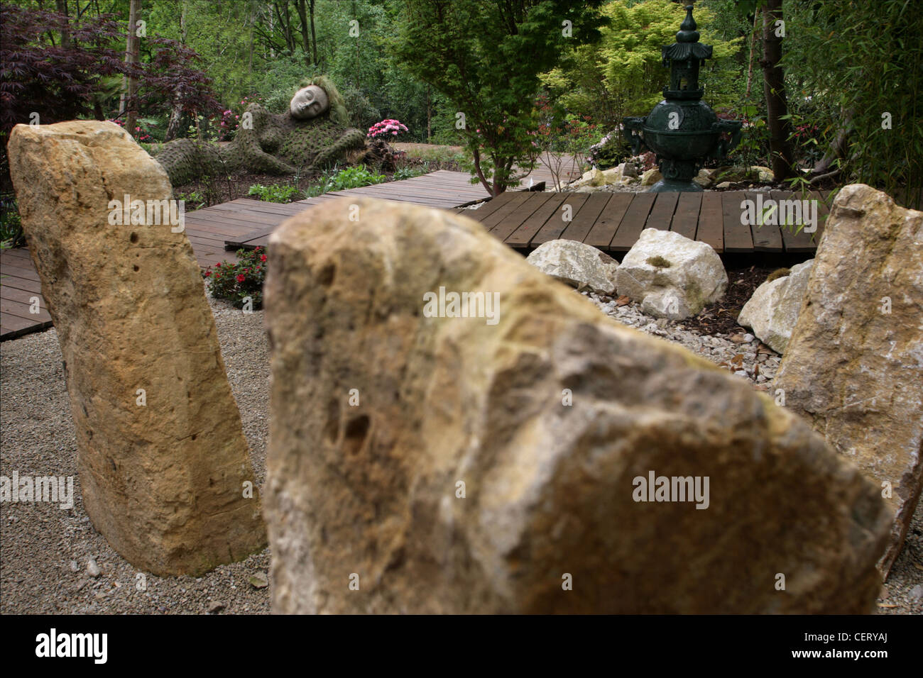A japanese style zen stone garden, large sand coloured stones and white ...
