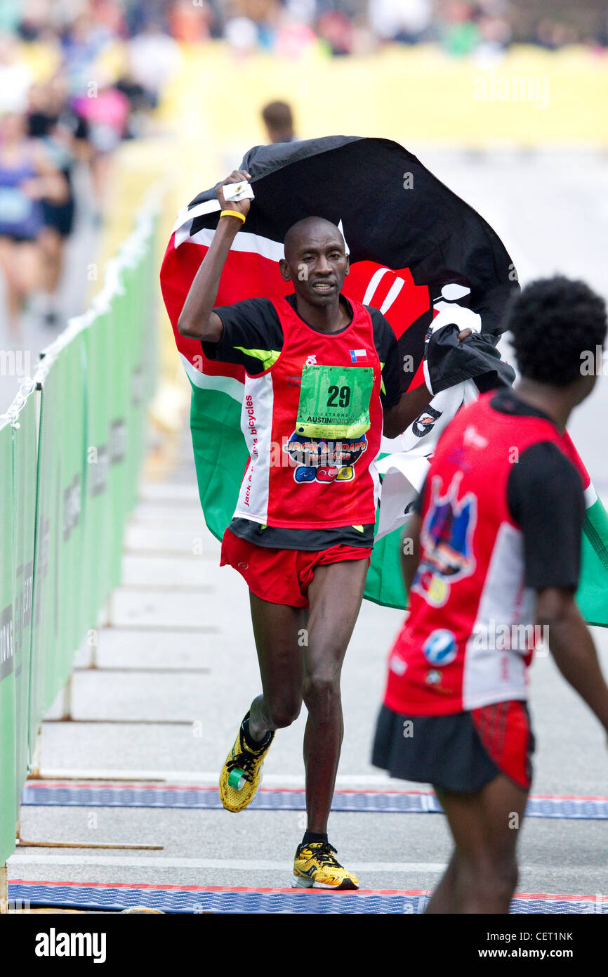 African male runner from Kenya celebrates win carrying flag from his ...