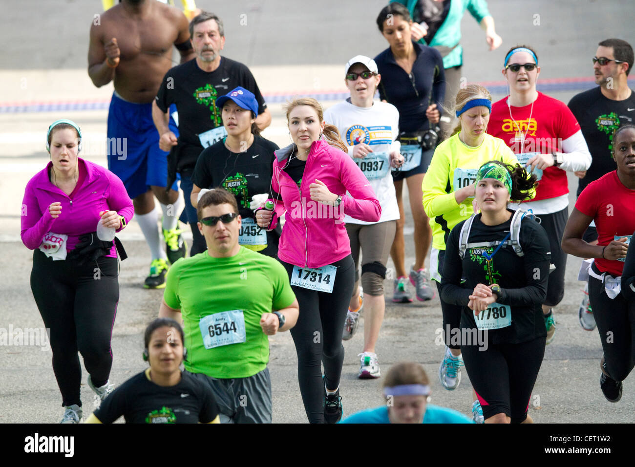 More than 18,000 runners athletes pounded the streets of downtown ...