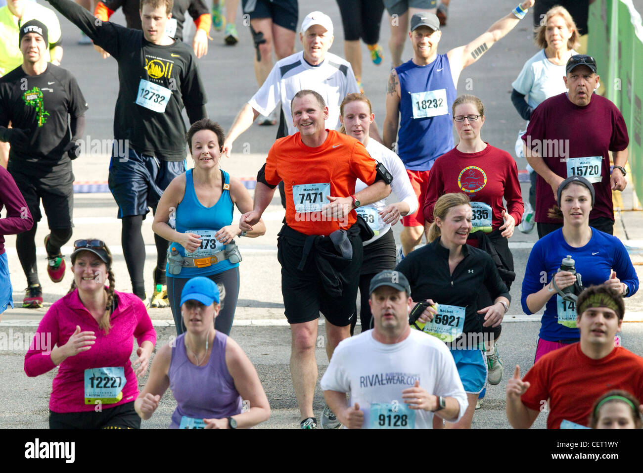 More than 18,000 runners athletes pounded the streets of downtown ...