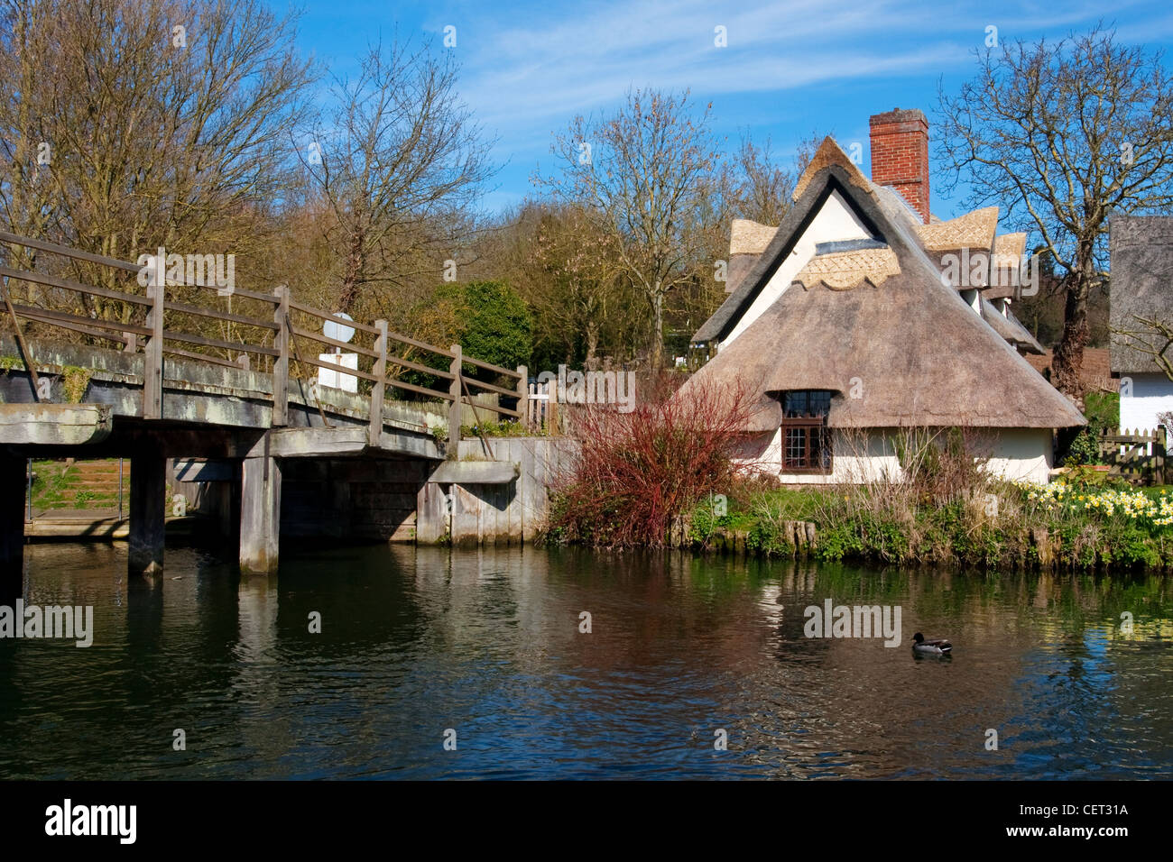 A wooden bridge over the River Stour leading to the 16th century Bridge ...