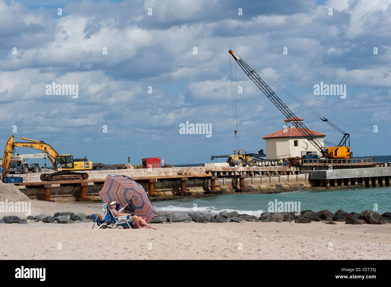 Woman beach pier restoration Stock Photo - Alamy