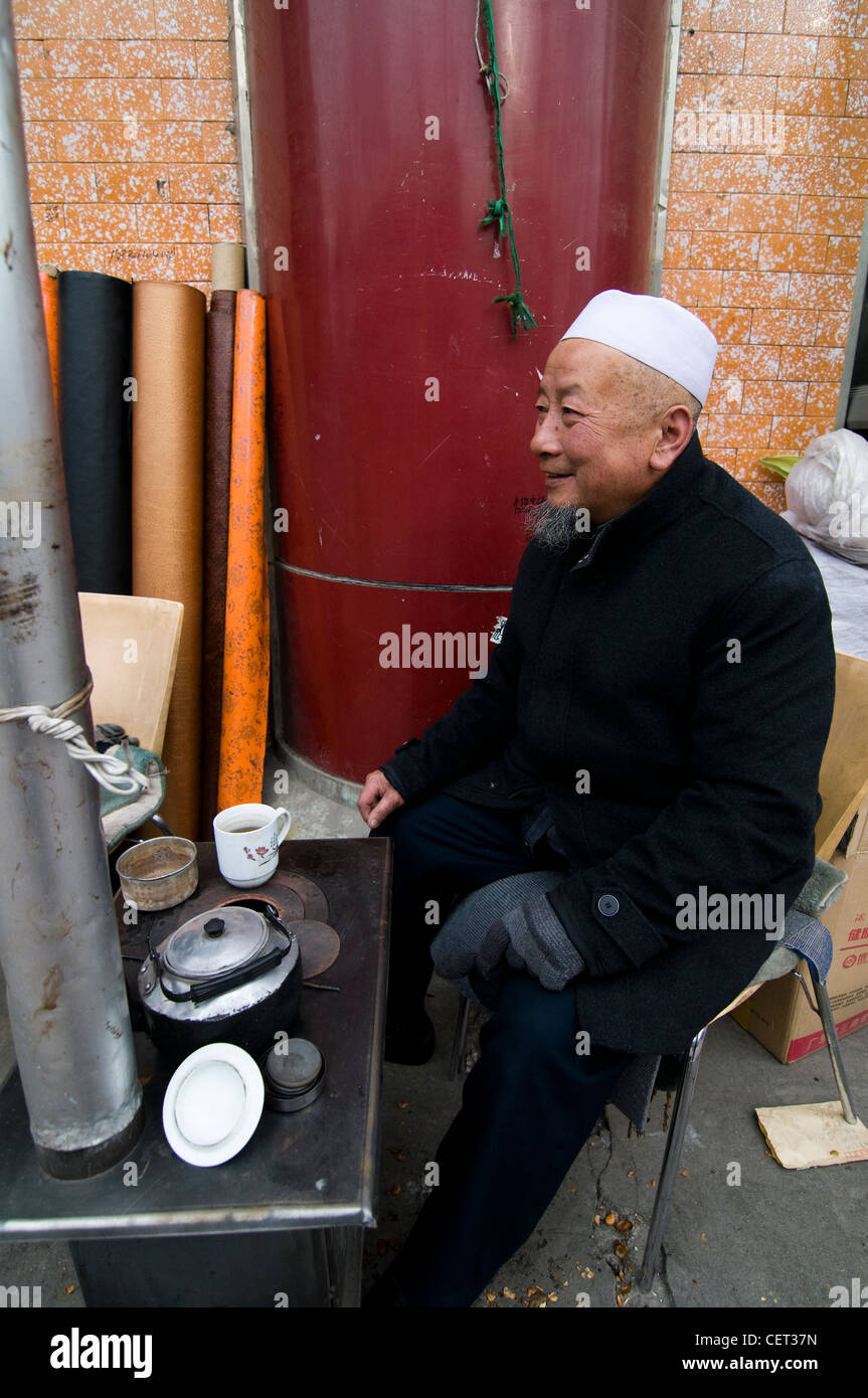 An Uyghur man enjoys a cup of tea Stock Photo - Alamy
