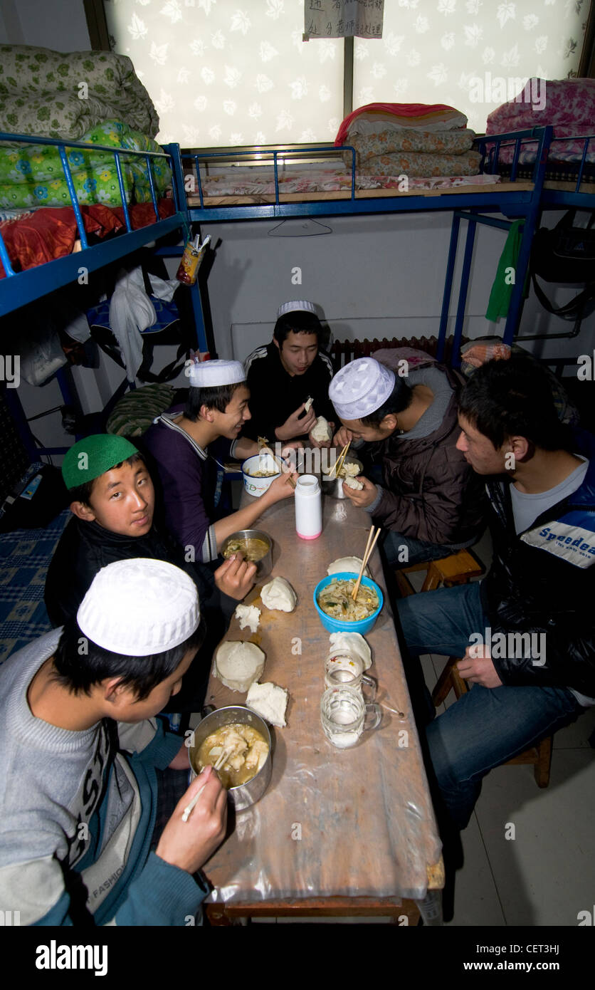 Hui Muslim children eating breakfast in their dorm room located in the ...