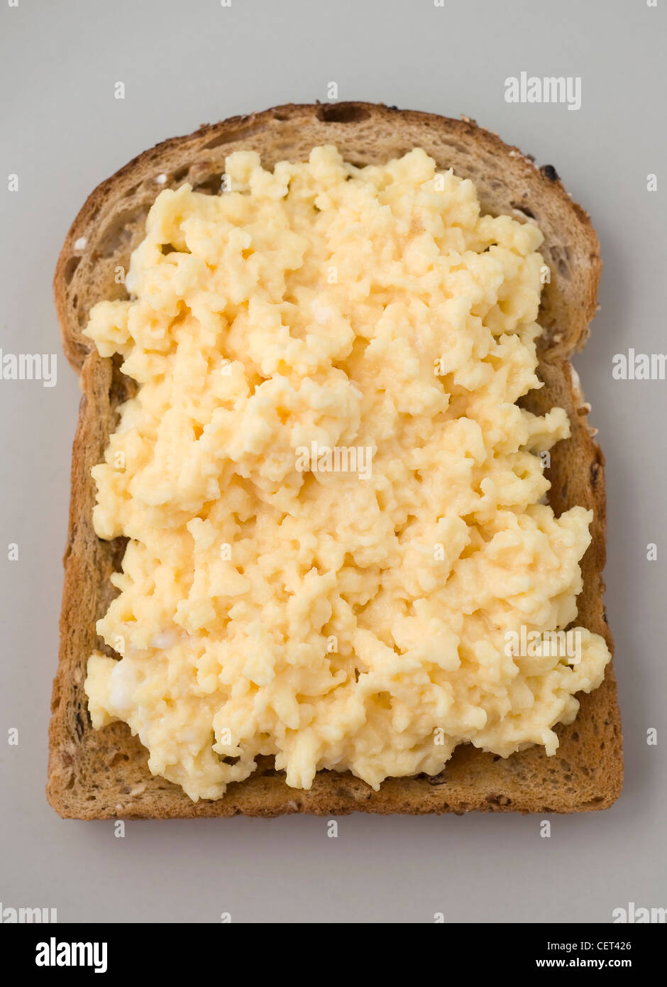 A slice of toasted bread with scrambled egg Stock Photo - Alamy