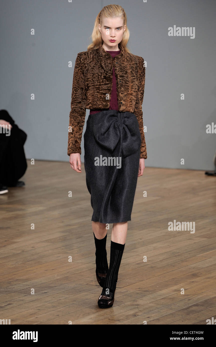 Nicole Farhi London Ready to Wear Autumn Winter Female model wearing a knee length grey skirt ...