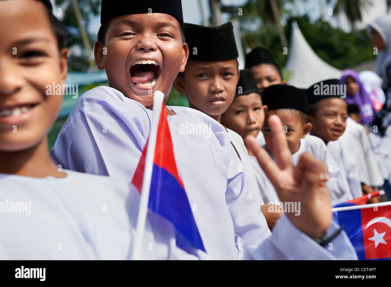 Young Muslim children smiling and holding peace signs in Johor ...