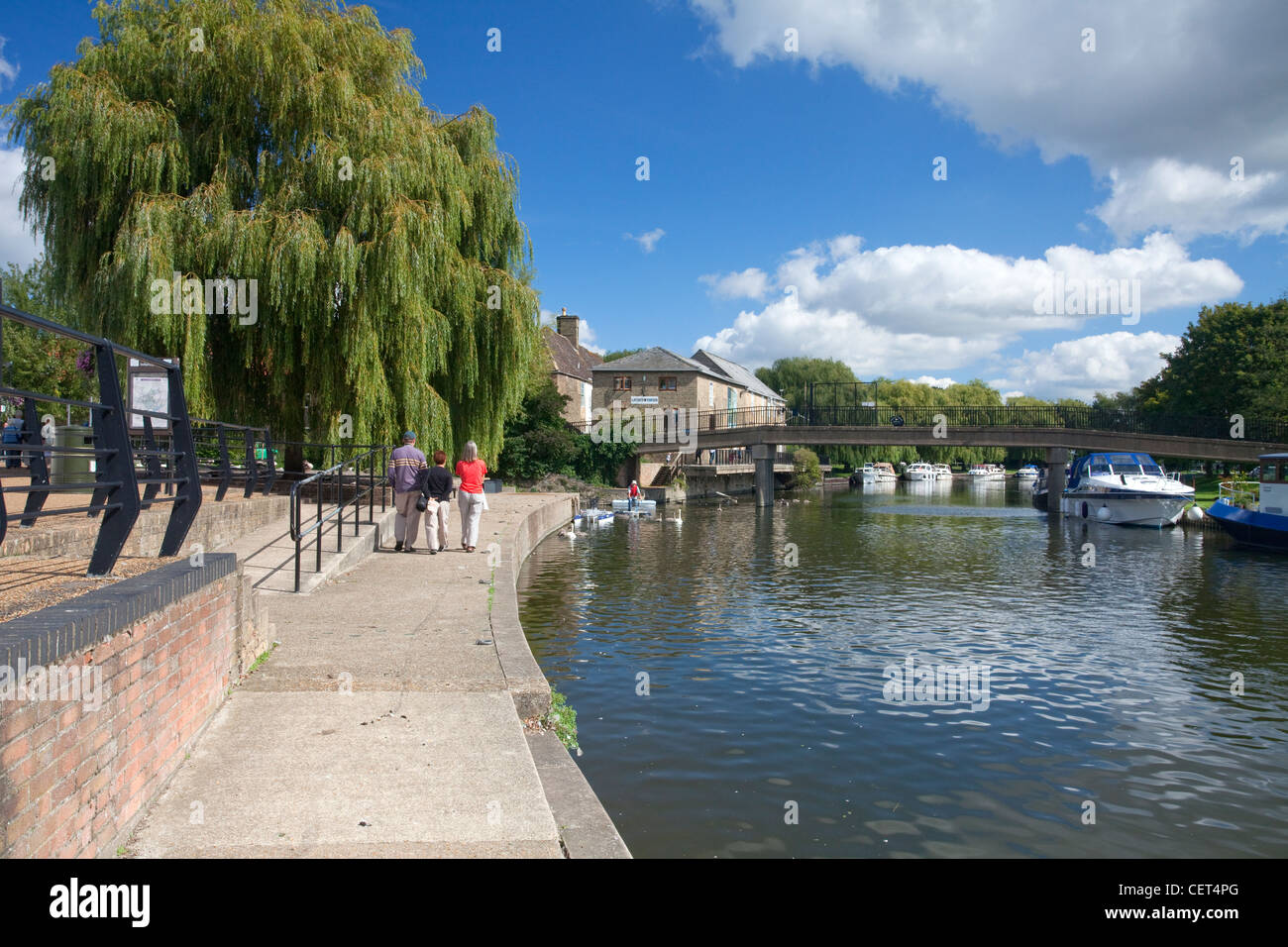 People walking along the riverside by the River Ouse at Ely Stock Photo ...