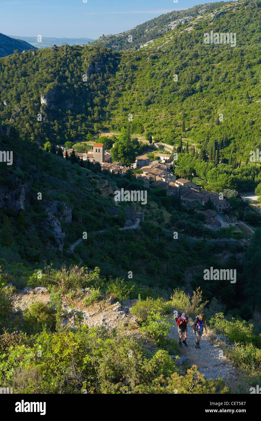 two women hikers, Gorge de l'Herault with the medieval village of Saint ...