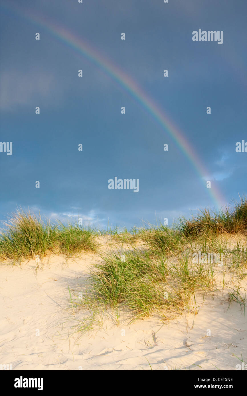 A rainbow over the sand dunes at Walberswick on the Suffolk Coast Stock ...