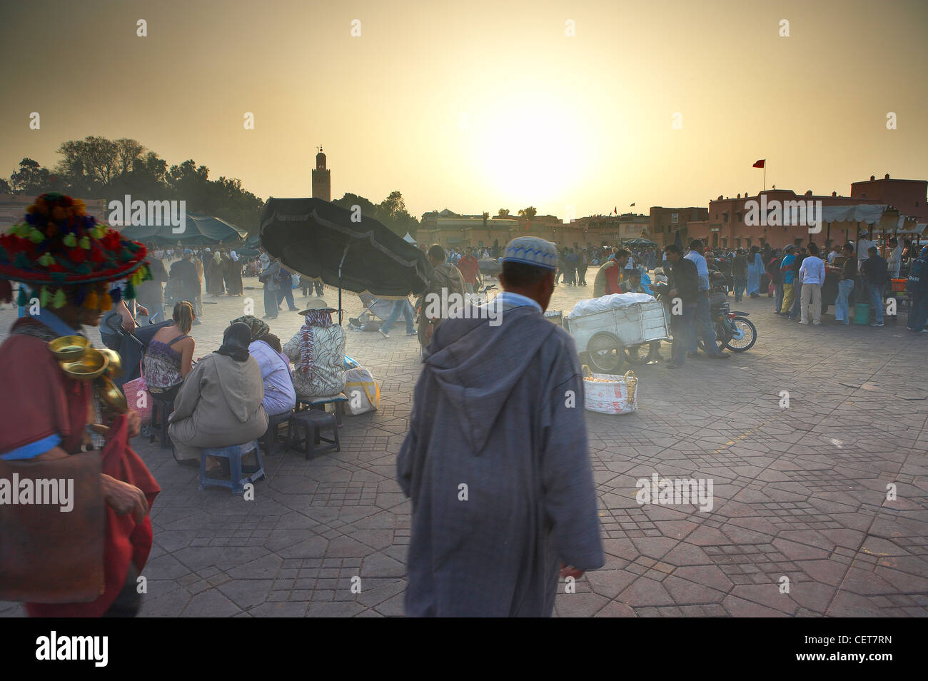 smoke from the barbecues drifting across the Place Jemaa-el-Fna ...
