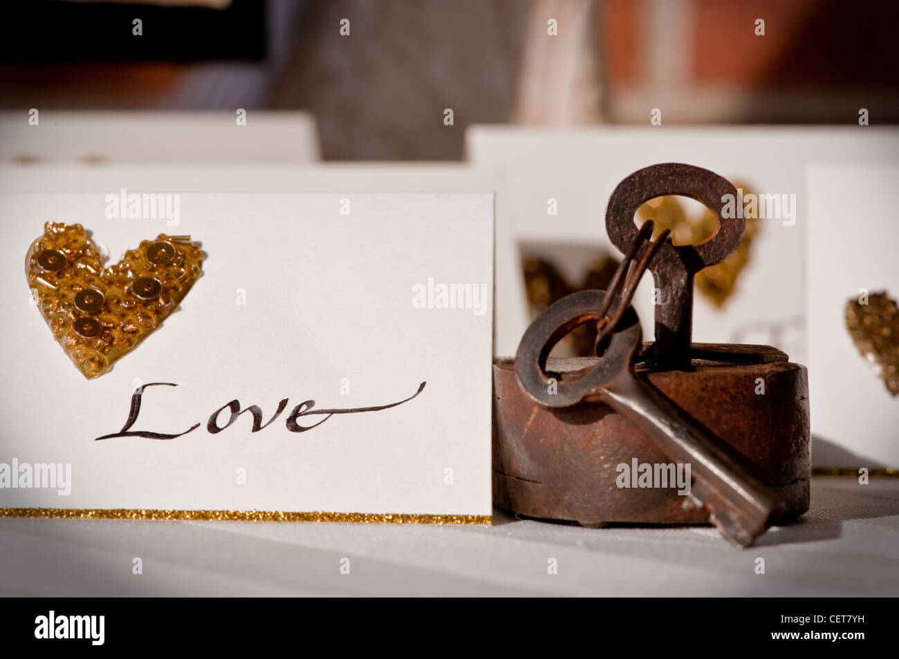 A letter "Love" on a card next to an old lock Stock Photo - Alamy