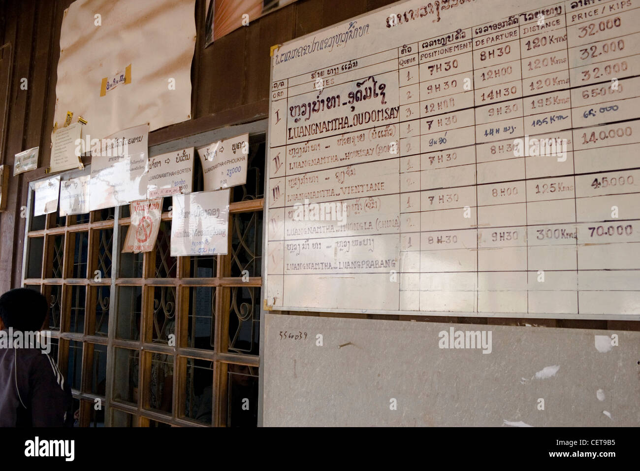 A schedule board sign helps visitors traveling to various destinations ...