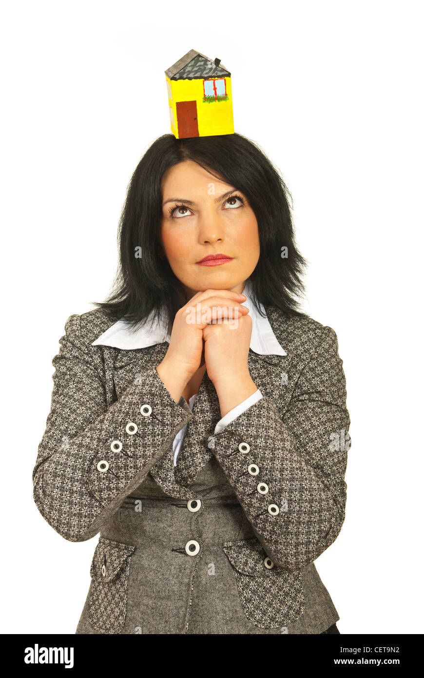 Business woman dreaming and having a house over her head isolated on ...