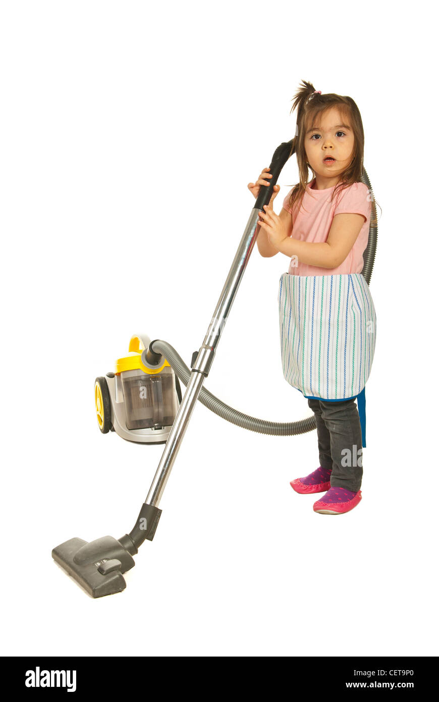 Cute little housewife cleaning house with vacuum cleaner isolated on ...