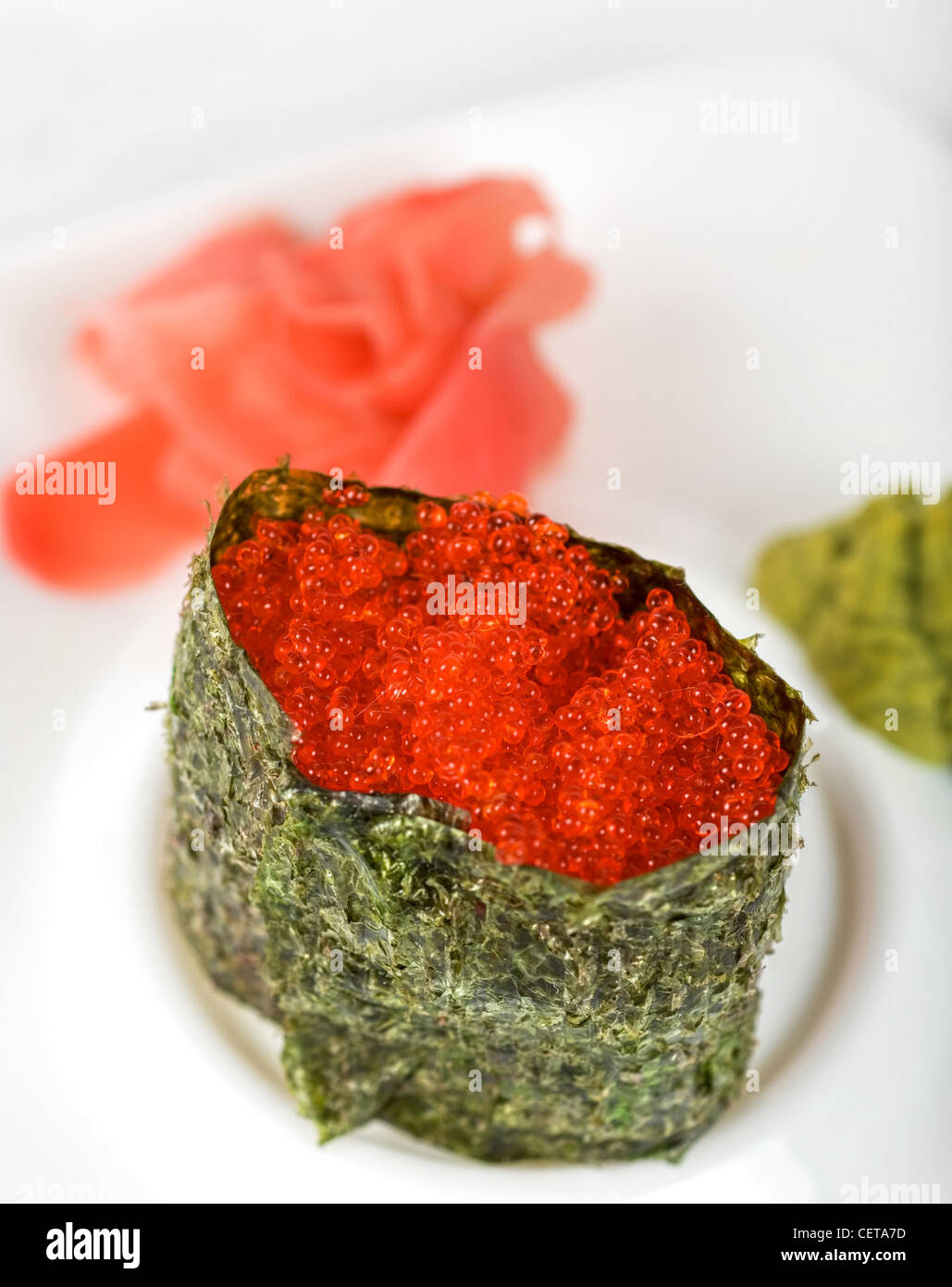 Red tobiko (flying fish roe) sushi closeup Stock Photo - Alamy