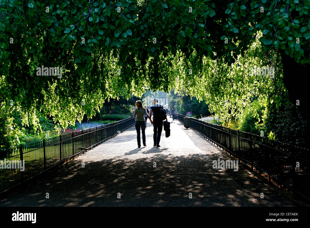 Couple strolling in the gardens hi-res stock photography and images - Alamy