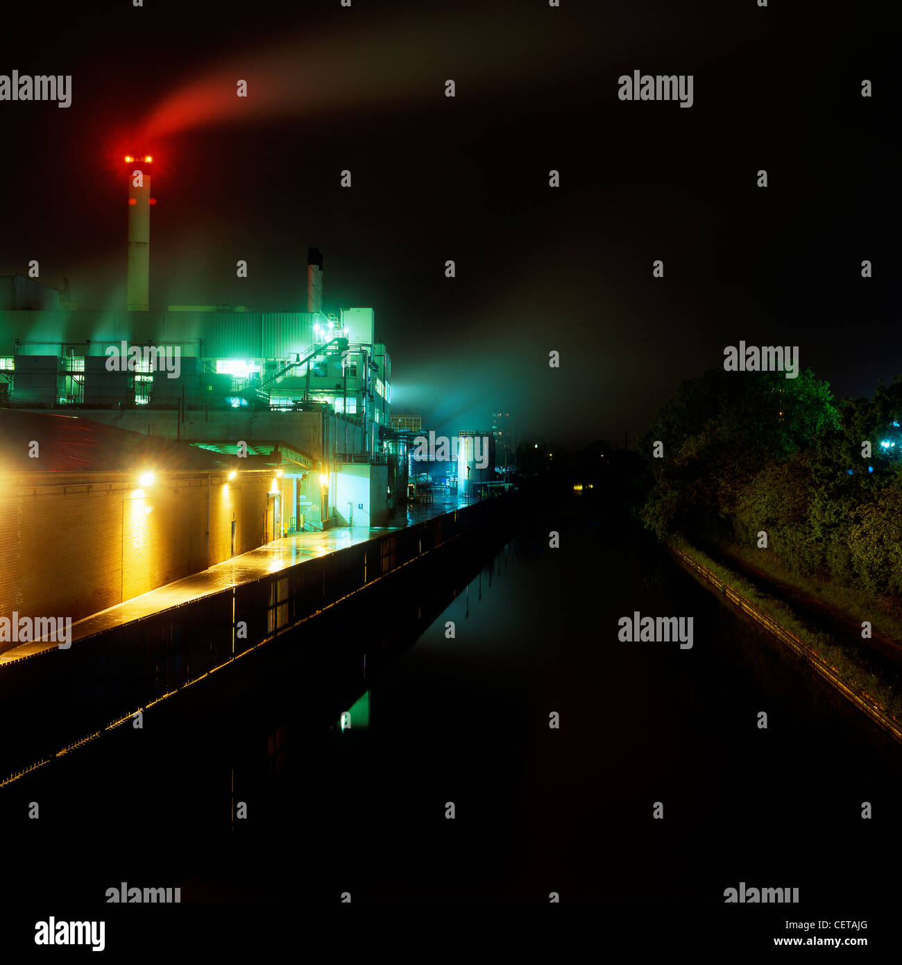 Nestle Factory at night. Nestle was founded in 1866 by Henri Nestle of ...