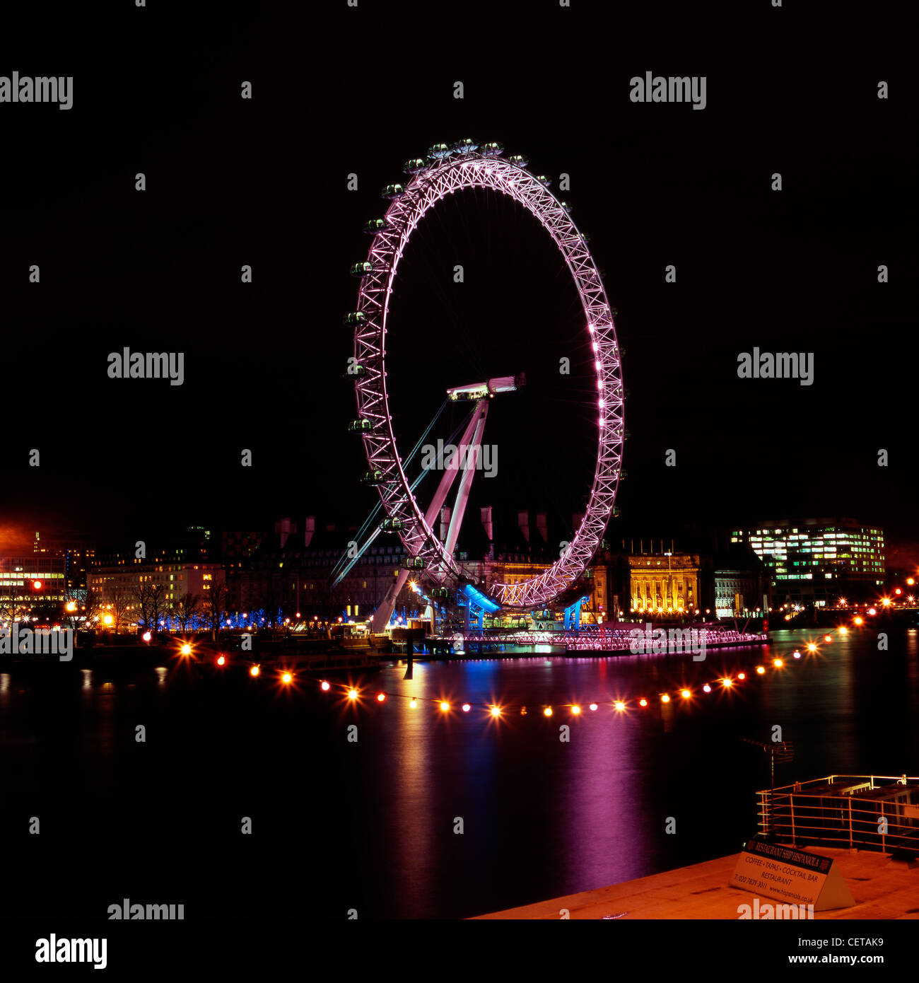 The London Eye at night. Opened in 1999, it stands 135m (443 ft) high ...