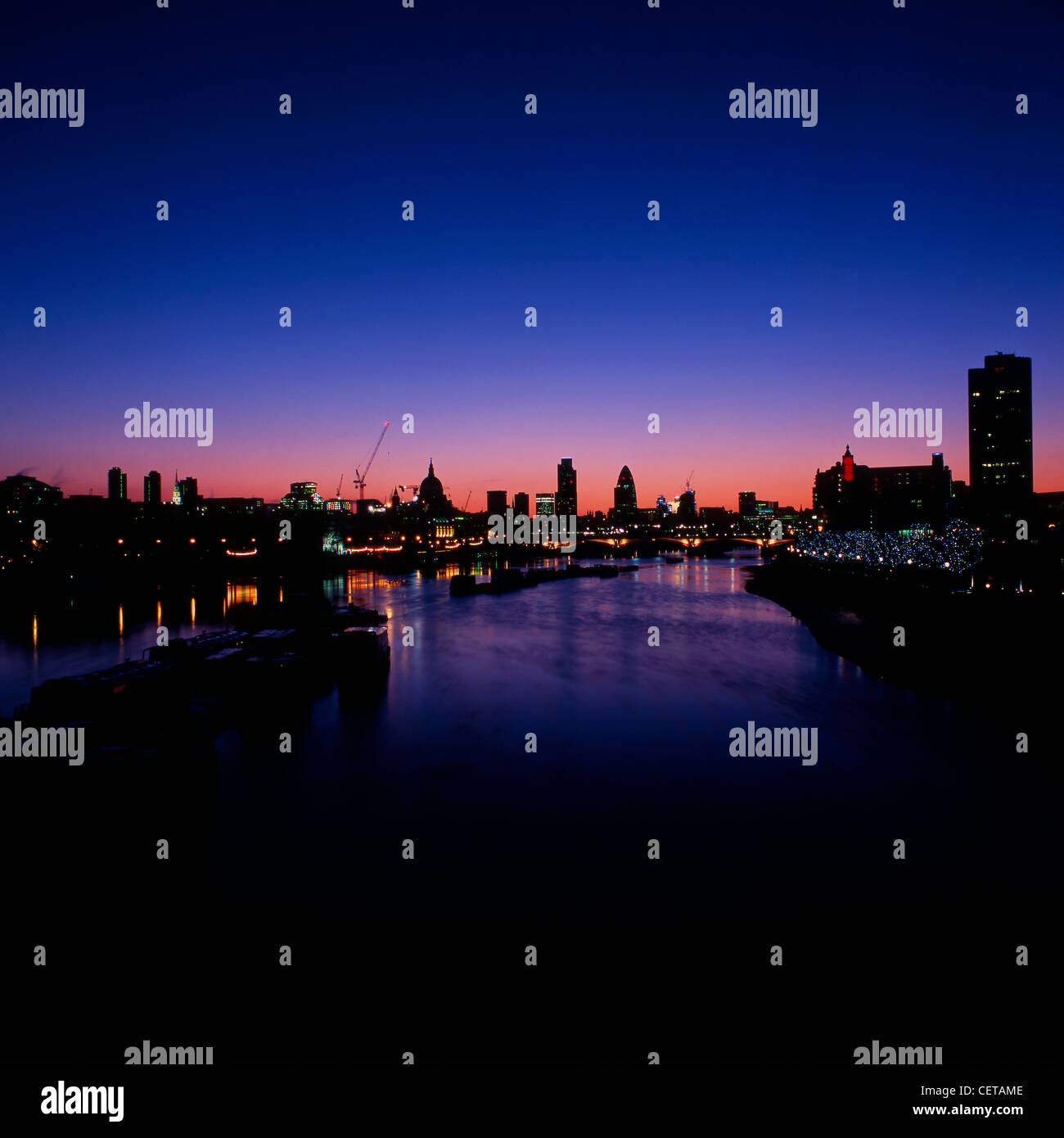 The skyline surrounding the River Thames looking east at dawn. The ...